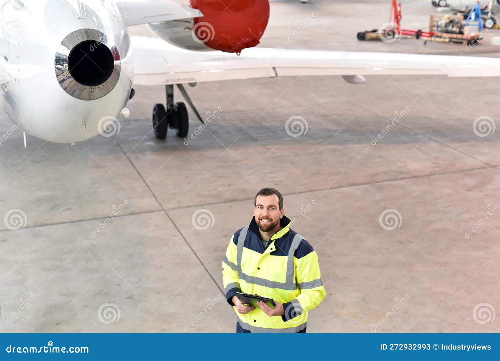 Airport Workers Check an Aircraft for Safety in a Hangar Stock Image ...