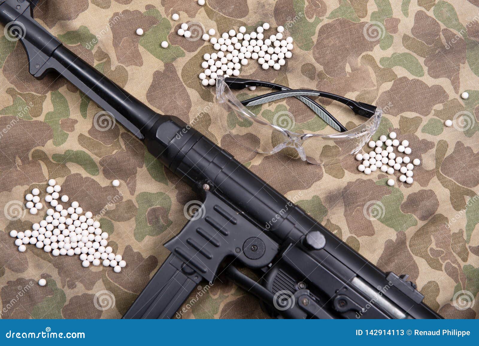 Airsoft Gun with Protective Glasses and Lot of Bullets Stock Image ...