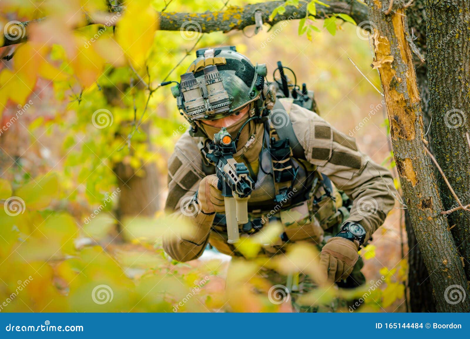 Airsoft Man in Uniform with Machine Gun Move through the Forest ...