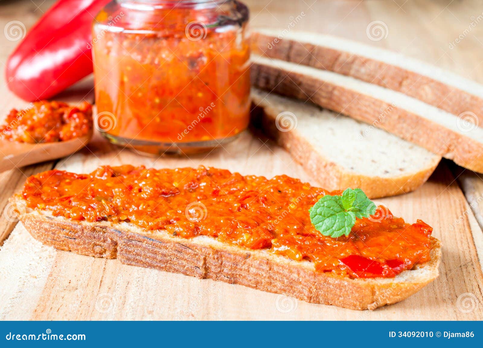 Ajvar on the bread stock photo. Image of healthy, blue - 34092010