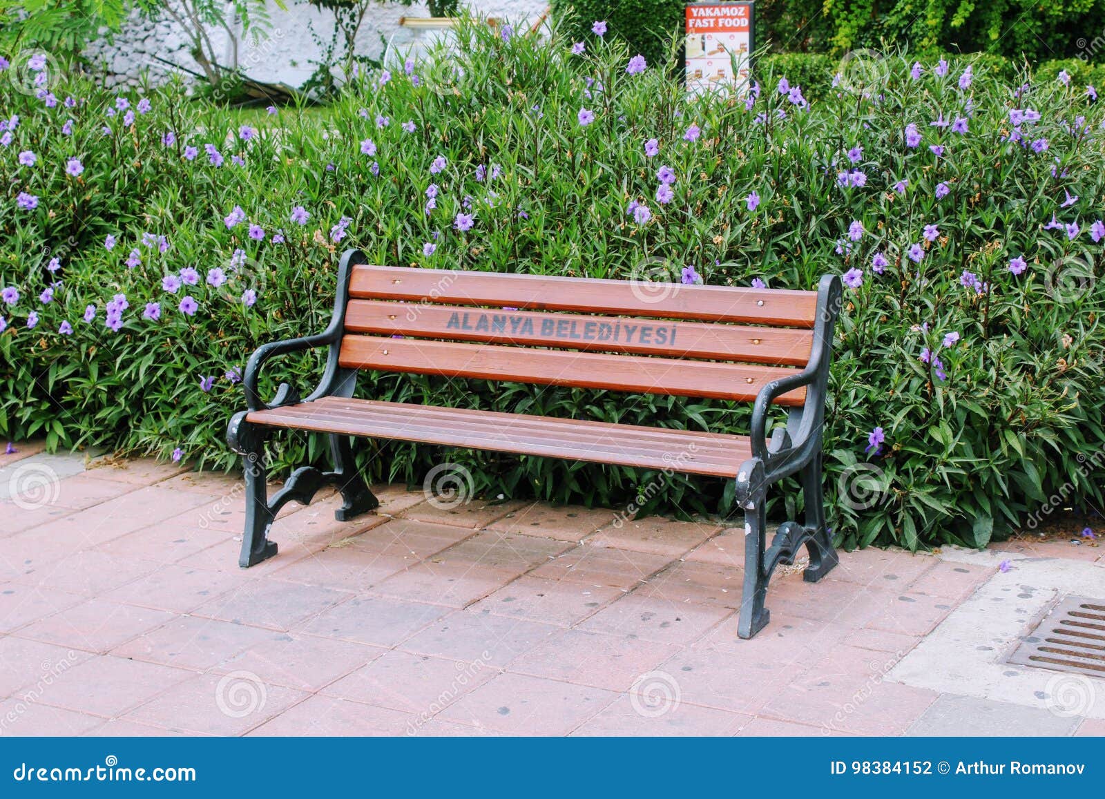 Alanya, Turkey, July 2017: a Wooden Bench in a Small Square Editorial ...