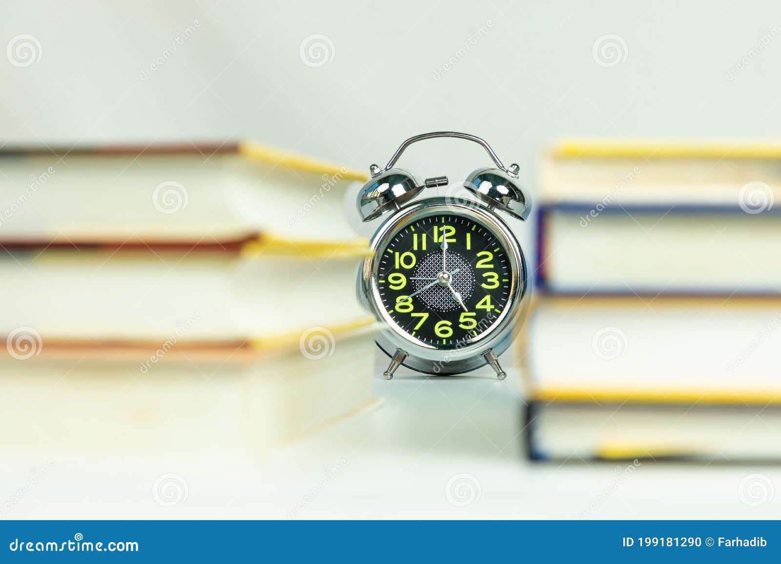 Alarm Clock through Books, Education Workspace Stock Photo - Image of ...