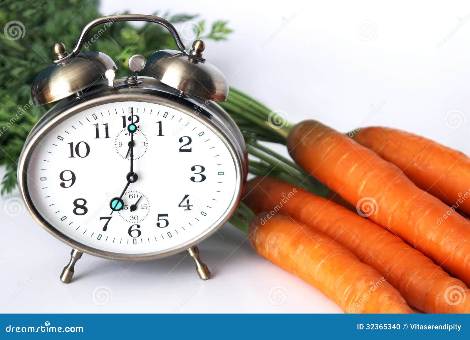 Alarm Clock at Bunch of Carrots Stock Photo - Image of breakfast, loss ...