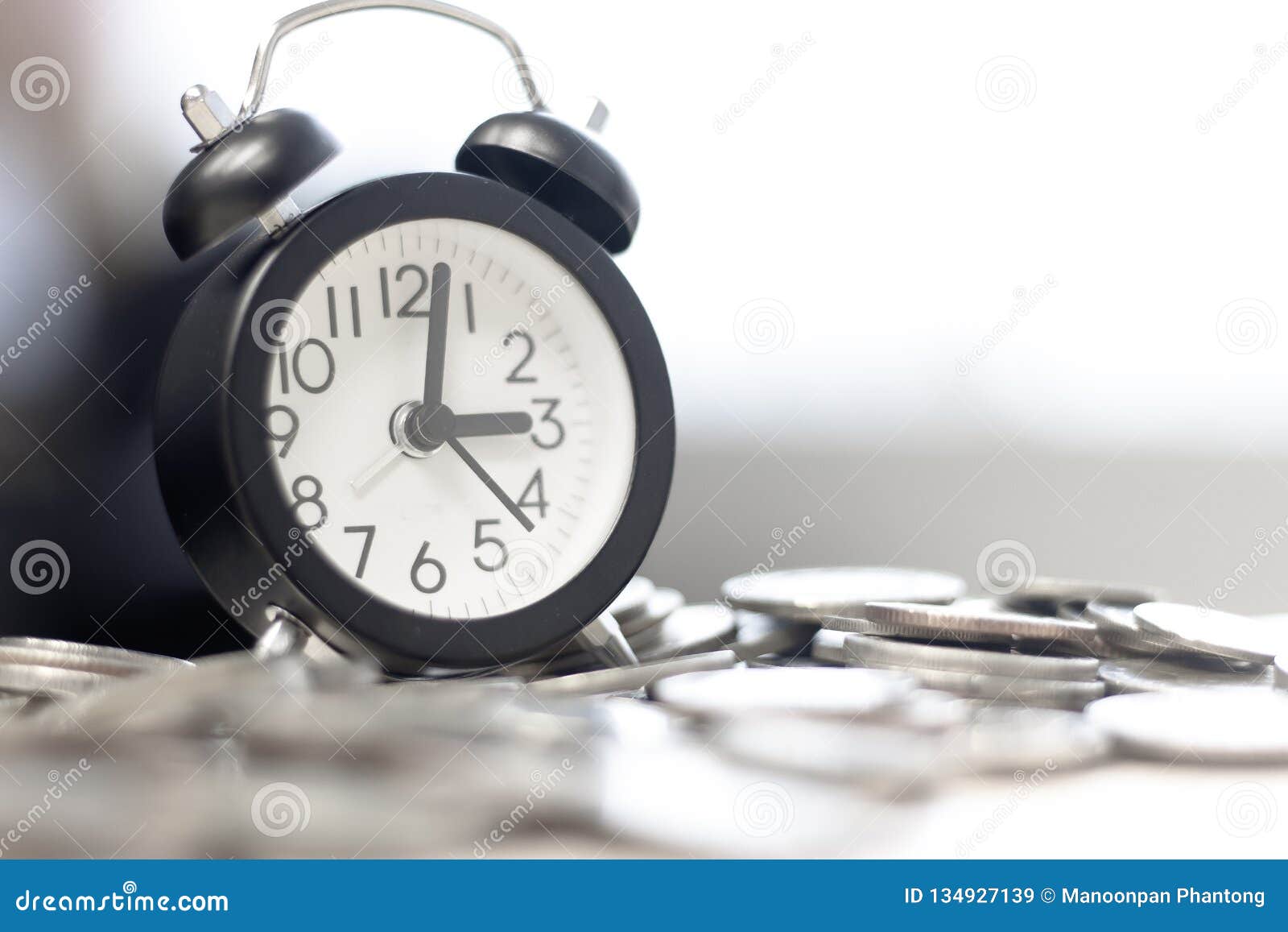 Alarm Clock and Coin Stack on the Table. Time Investment and Passing ...