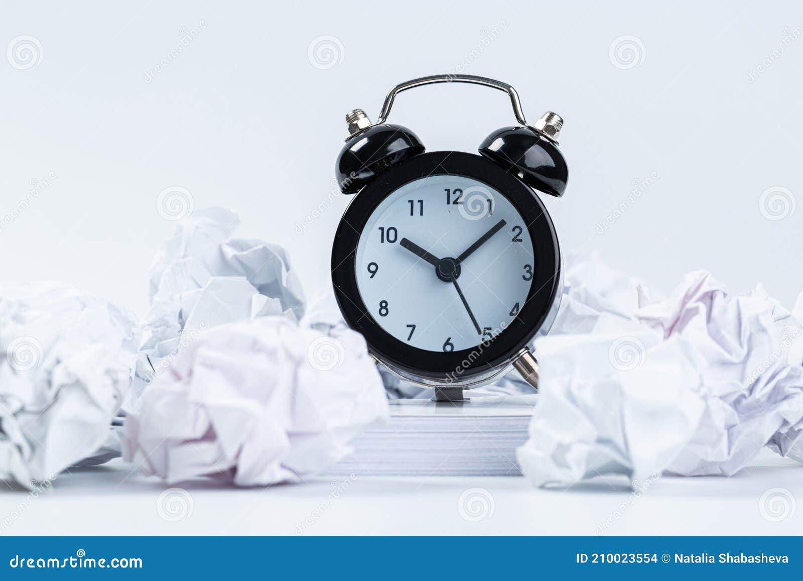 Alarm Clock with Crumpled Paper Balls.Timing and Thinking Idea Concept ...