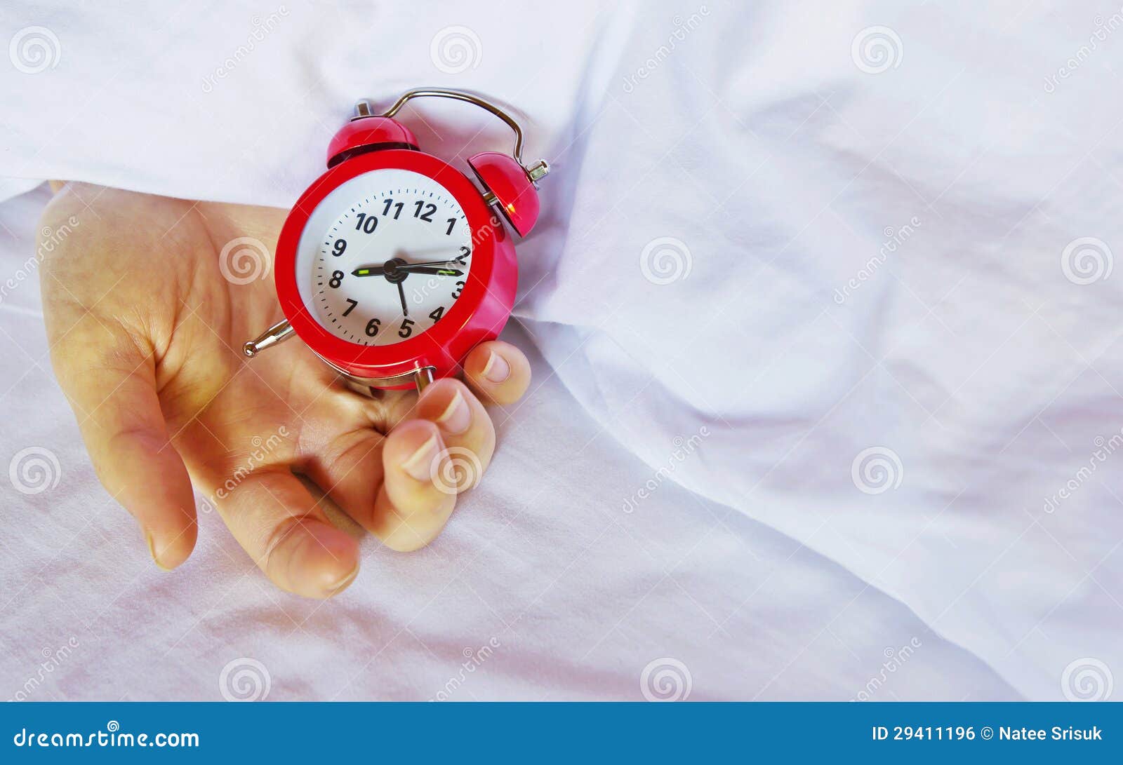 Alarm clock on hand stock photo. Image of hand, time - 29411196