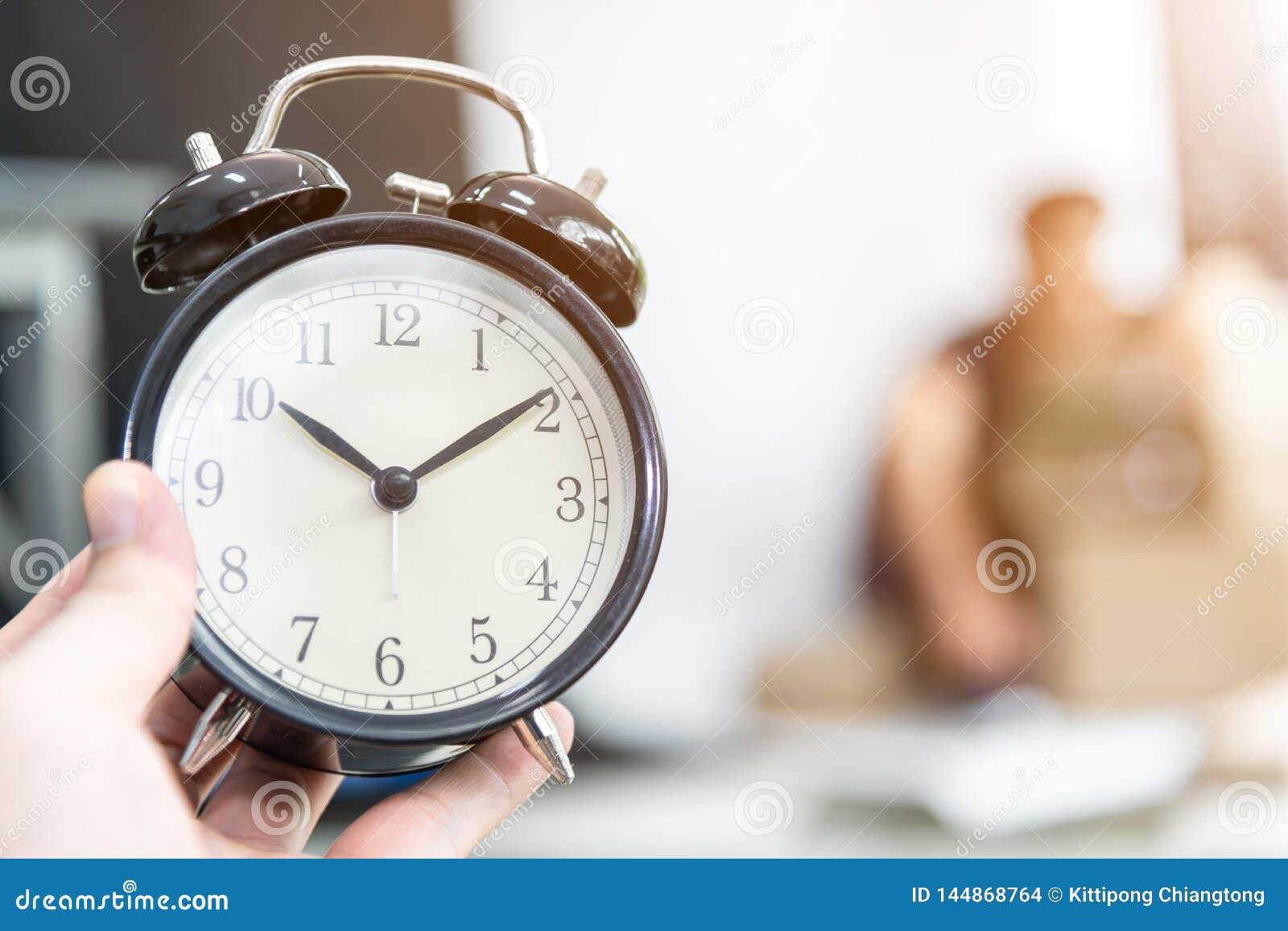 Alarm Clock in Hand with Worker Man is Working always on Time at Work ...