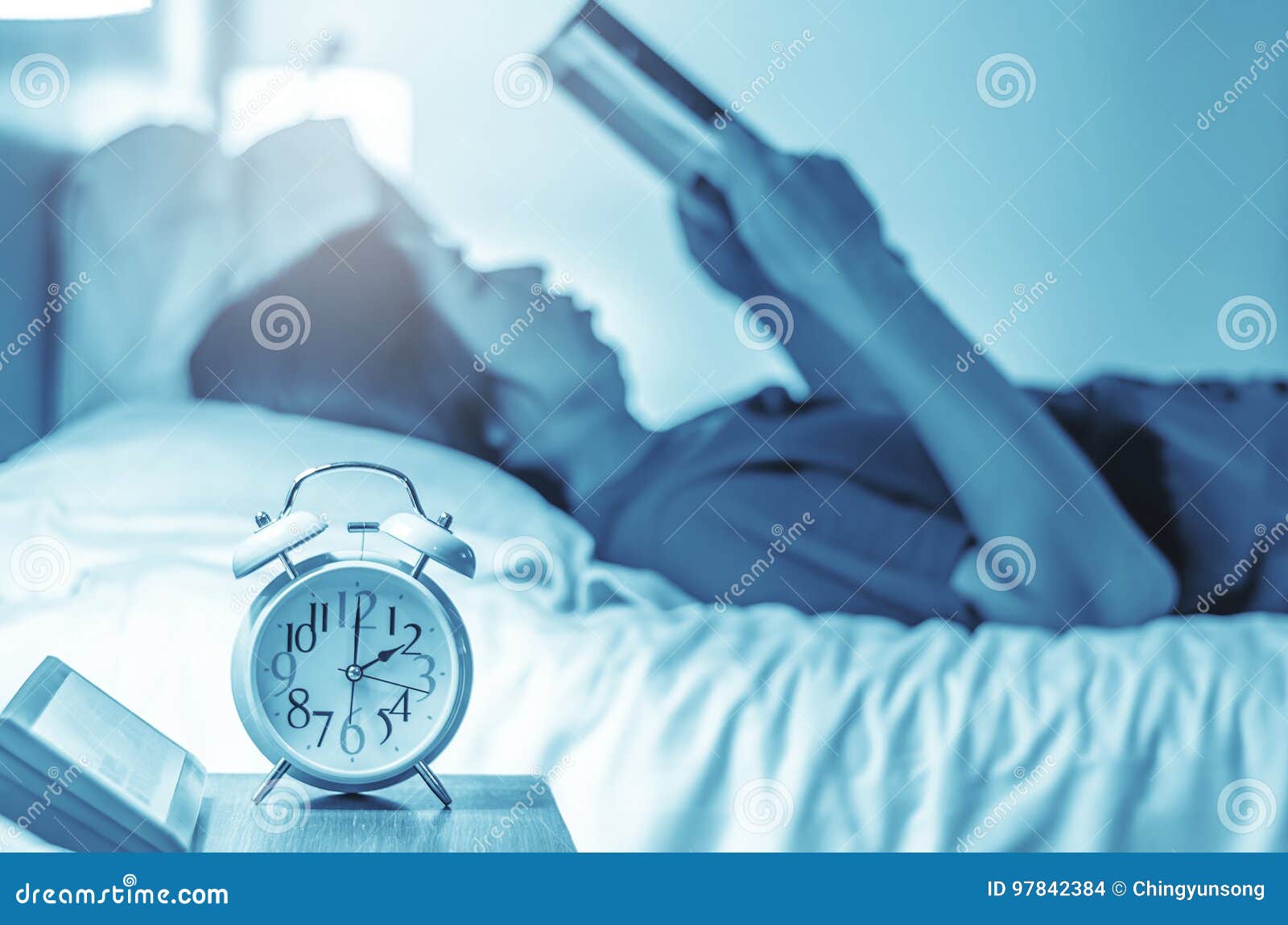Alarm Clock with Man Reading Book Stock Photo - Image of people ...