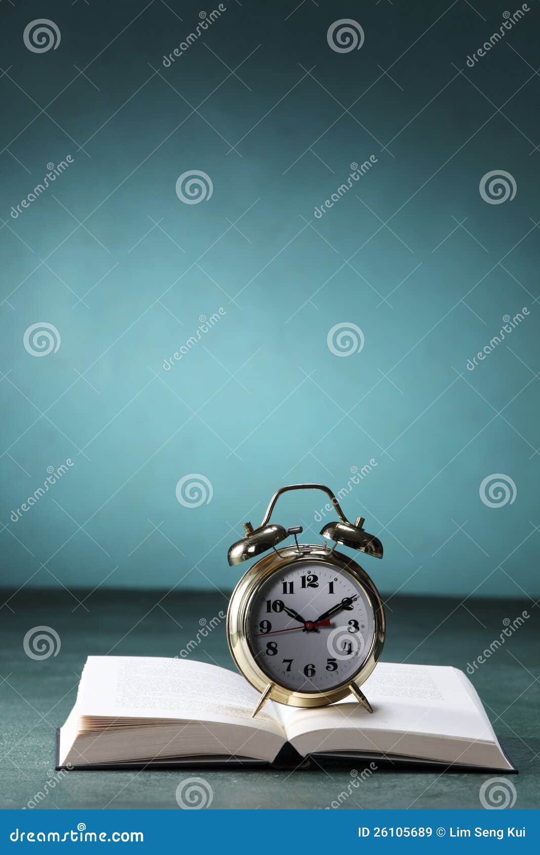 Alarm clock on open book stock image. Image of ideas - 26105689