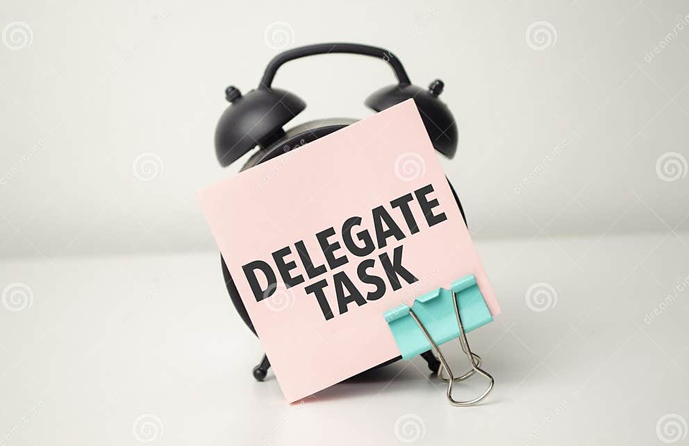 Alarm Clock with Pink Sticker with the Text Delegate Task Stock Photo ...