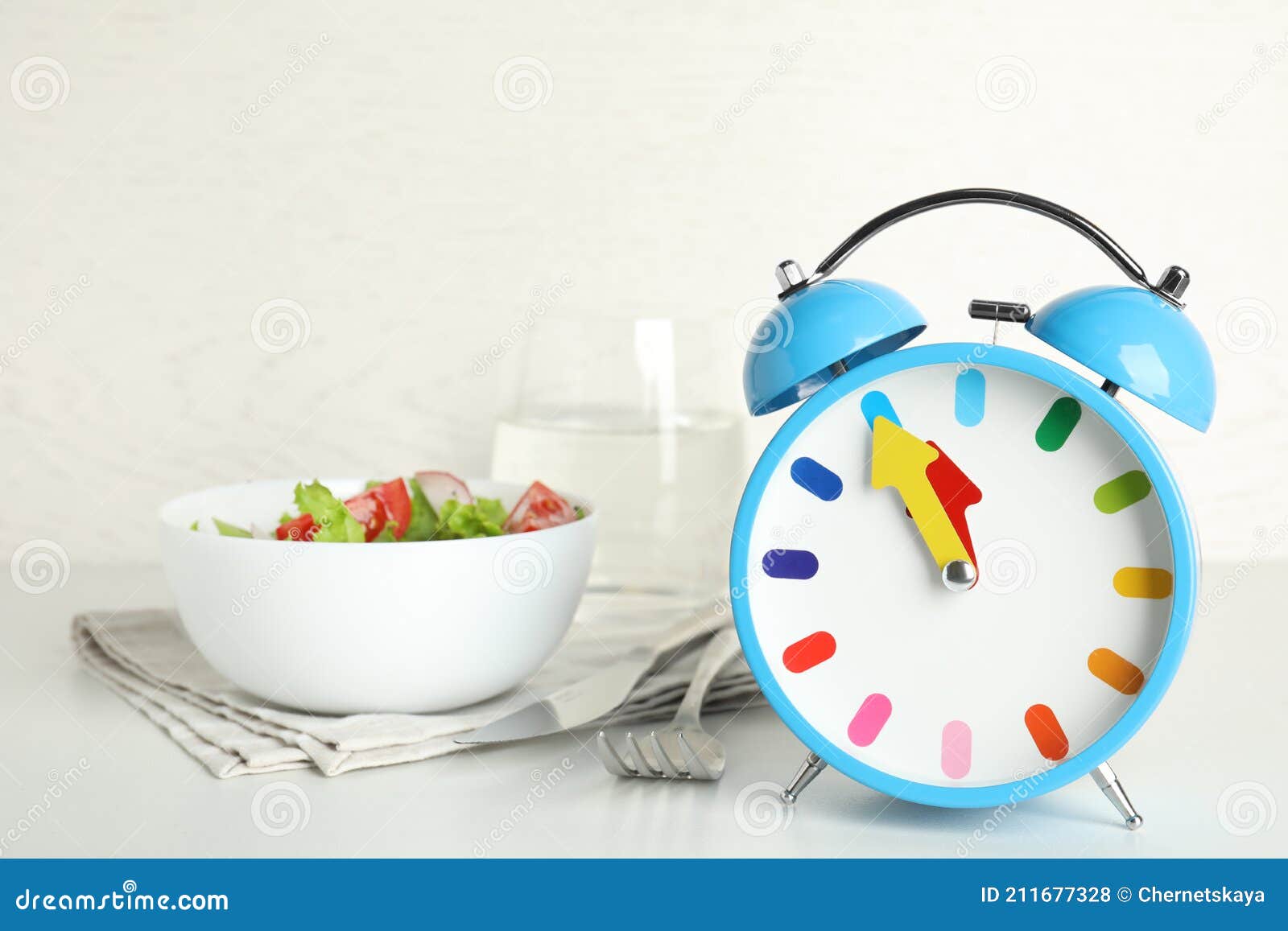 Alarm Clock with Salad on White Table. Meal Timing Concept Stock Photo ...
