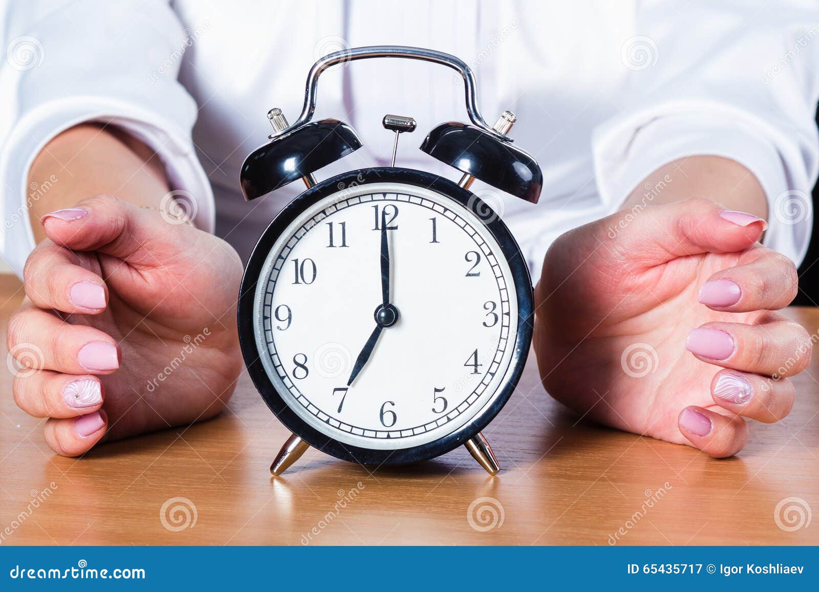 Alarm Clock at Seven O Clock Stock Image - Image of black, timepiece ...