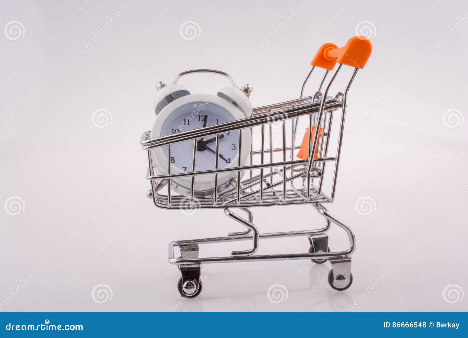 Alarm Clock in Shopping Trolley on White Background Stock Photo - Image ...