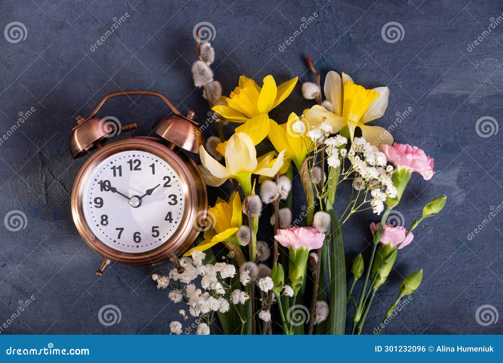 Alarm Clock with Spring Flowers. Spring Time, Daylight Savings Concept ...