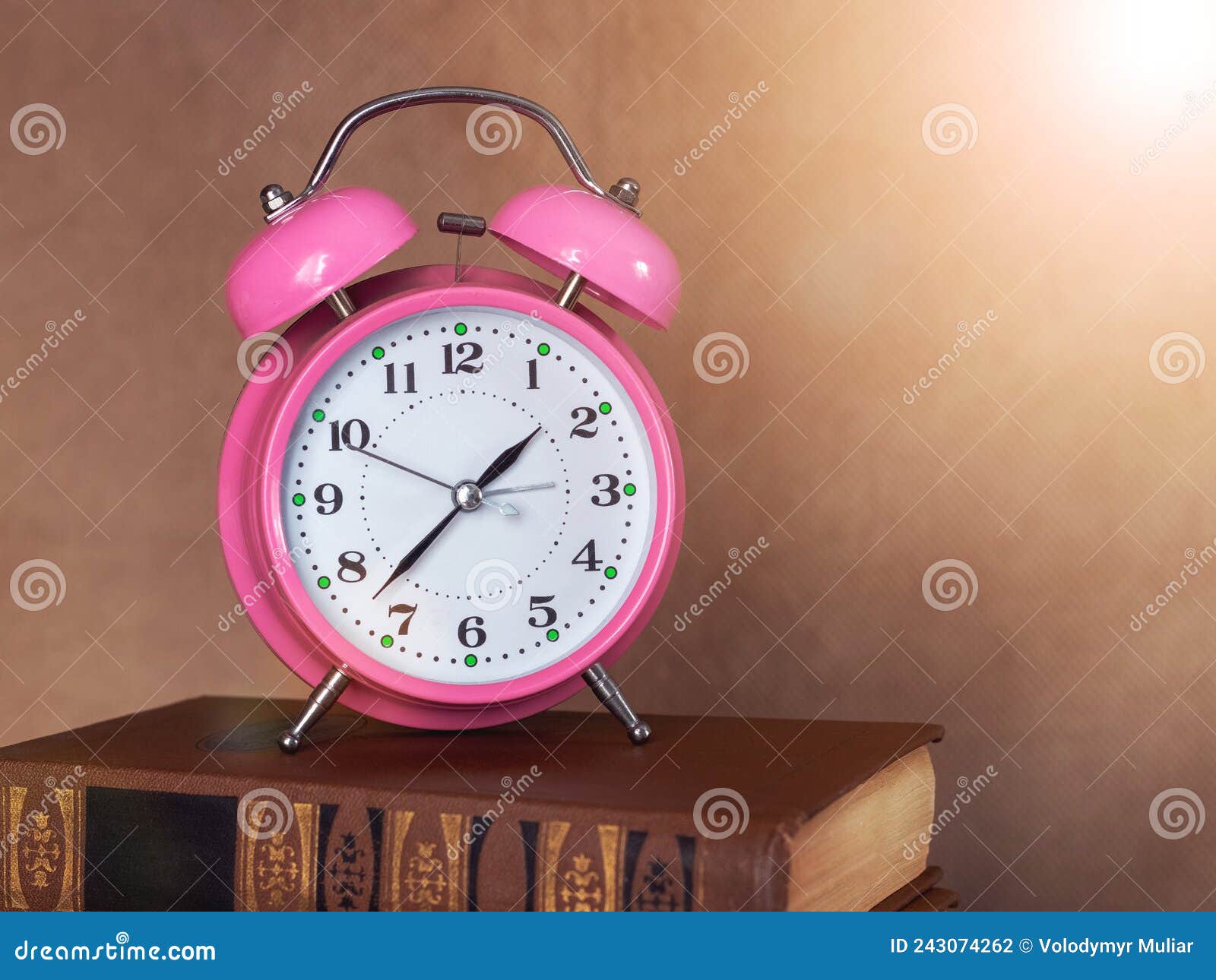 Alarm Clock on a Stack of Books in the Library Stock Photo - Image of ...