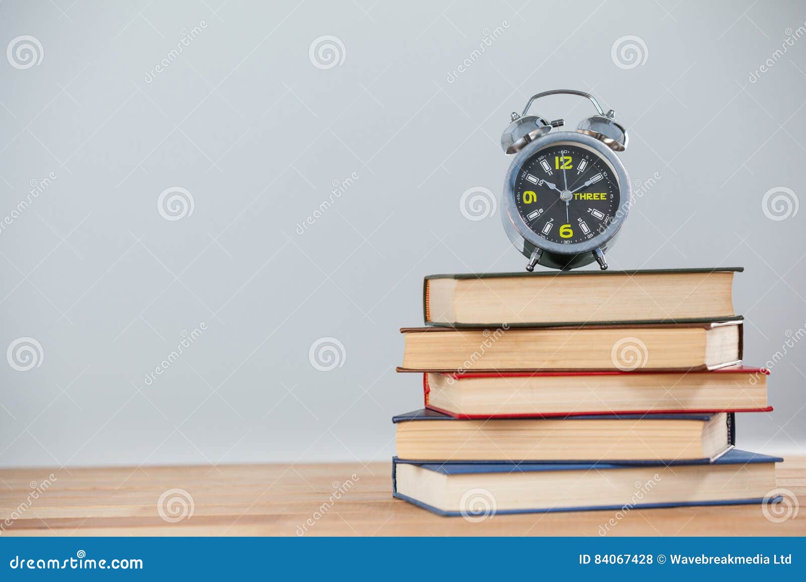 Alarm Clock and Stack of Books Stock Photo - Image of reading, bell ...