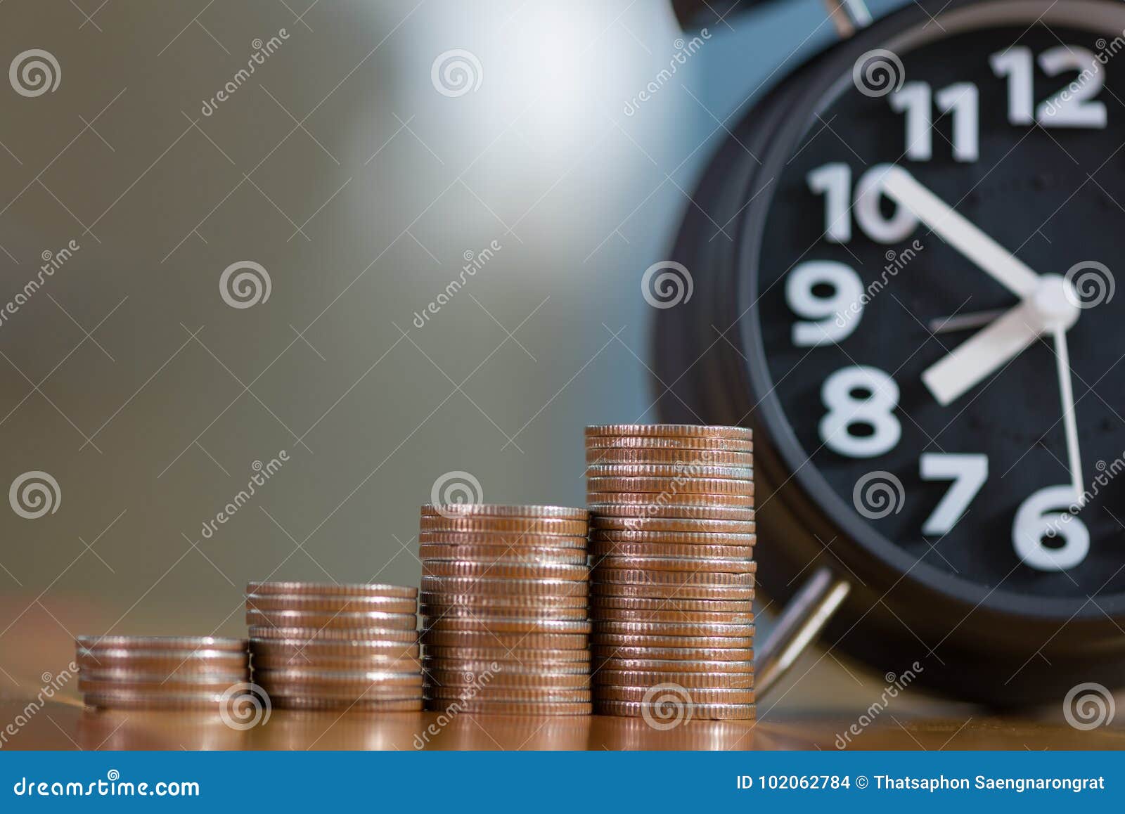 Alarm Clock and Step of Coins Stacks on Working Table, Time for Stock ... Alarm Clock and Step of Coins Stacks on Working Table, Time for Stock ...