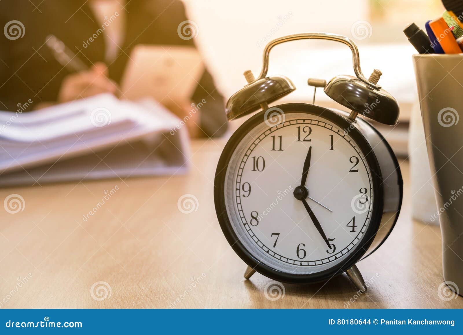 Alarm clock on the table stock photo. Image of management - 80180644