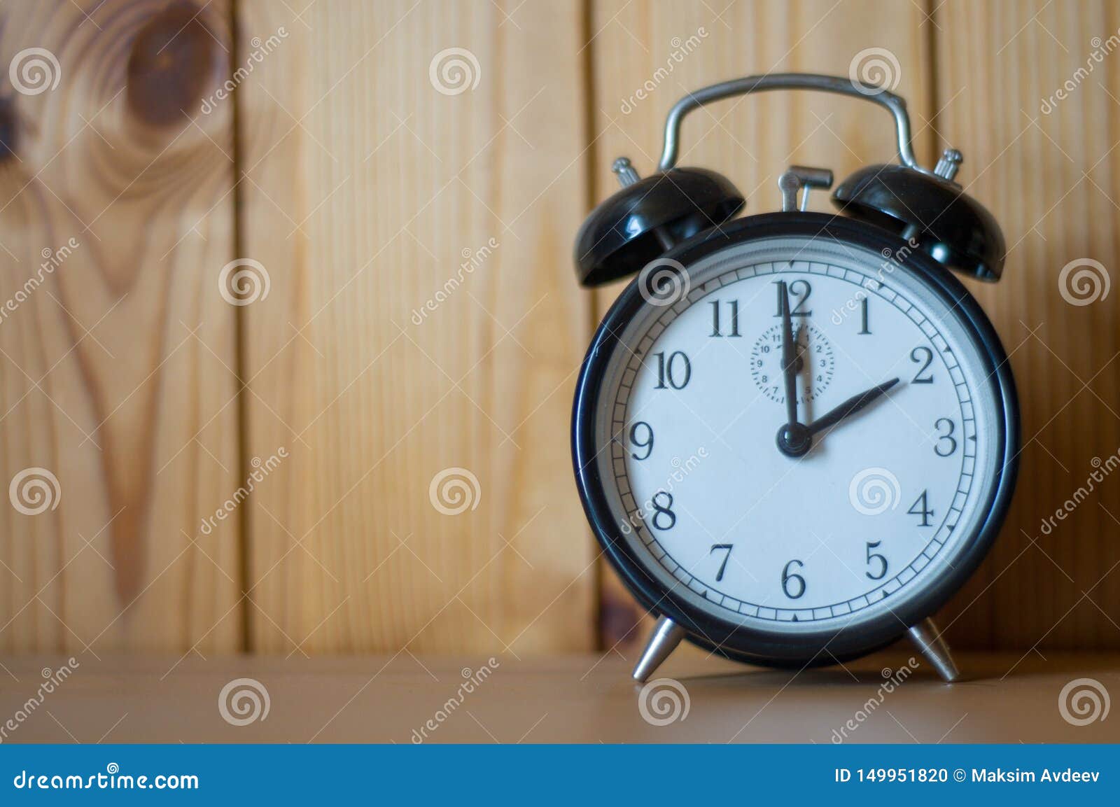 Alarm clock on table. Time stock photo. Image of clock - 149951820