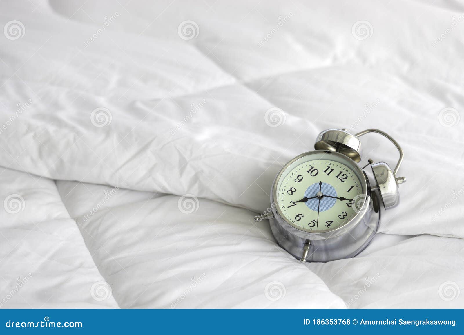 Alarm Clock on White Blanket in Bed Room Stock Photo - Image of object ...