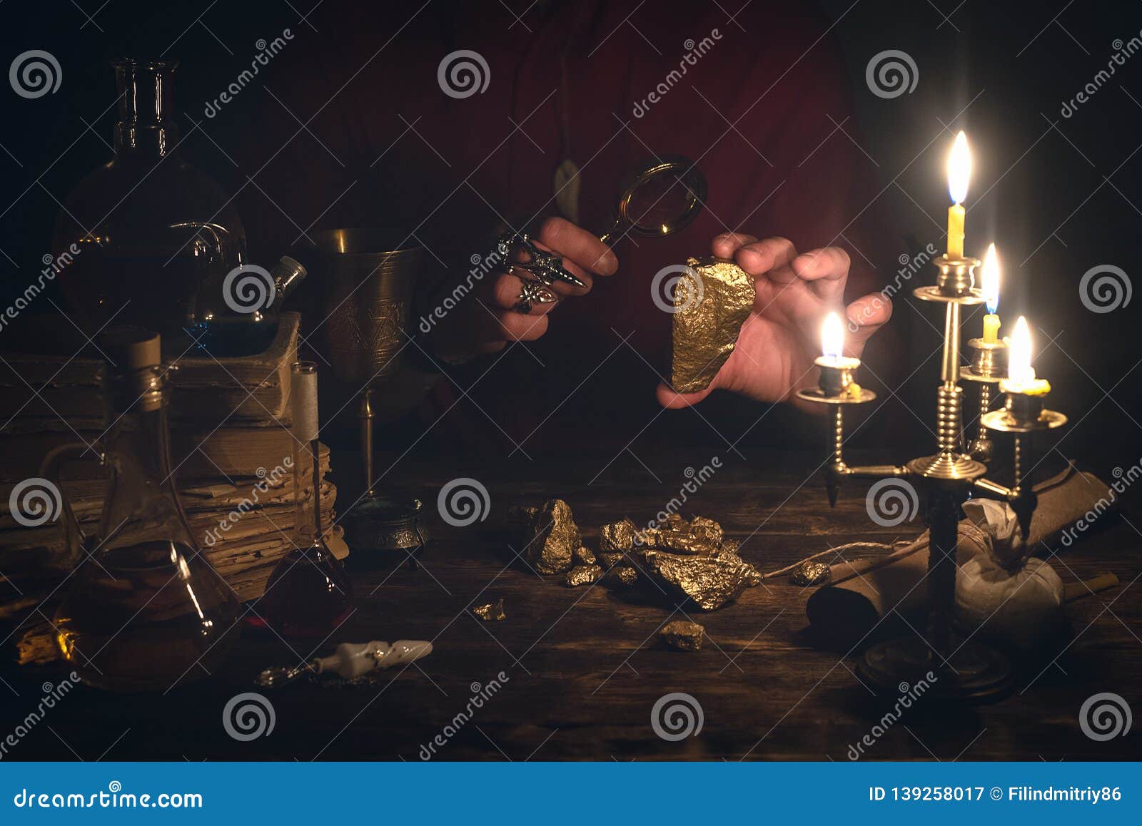 Alchemist. stock image. Image of scroll, holding, nugget - 139258017