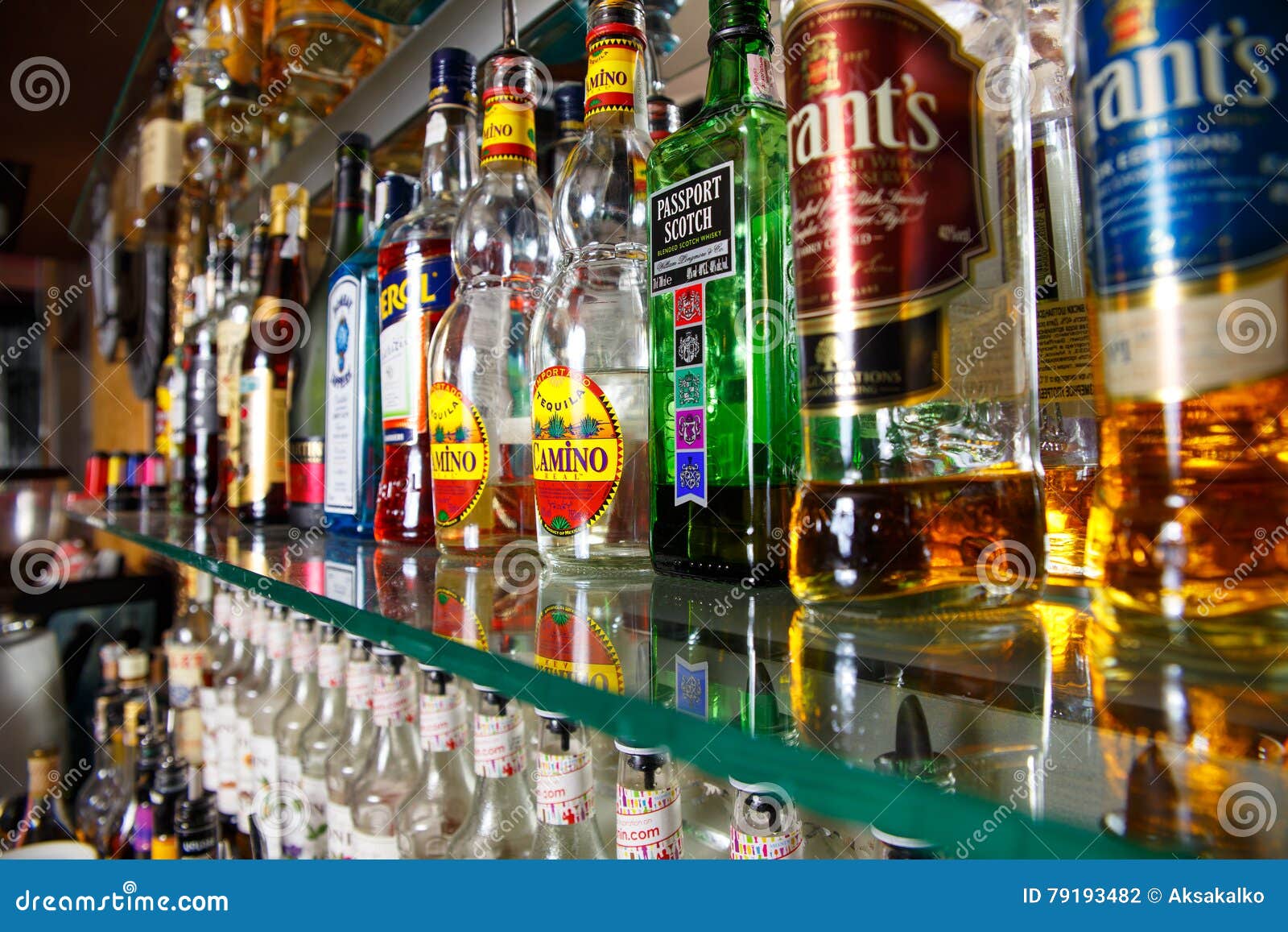 Alcohol bottles on a bar editorial photography. Image of closeup - 79193482