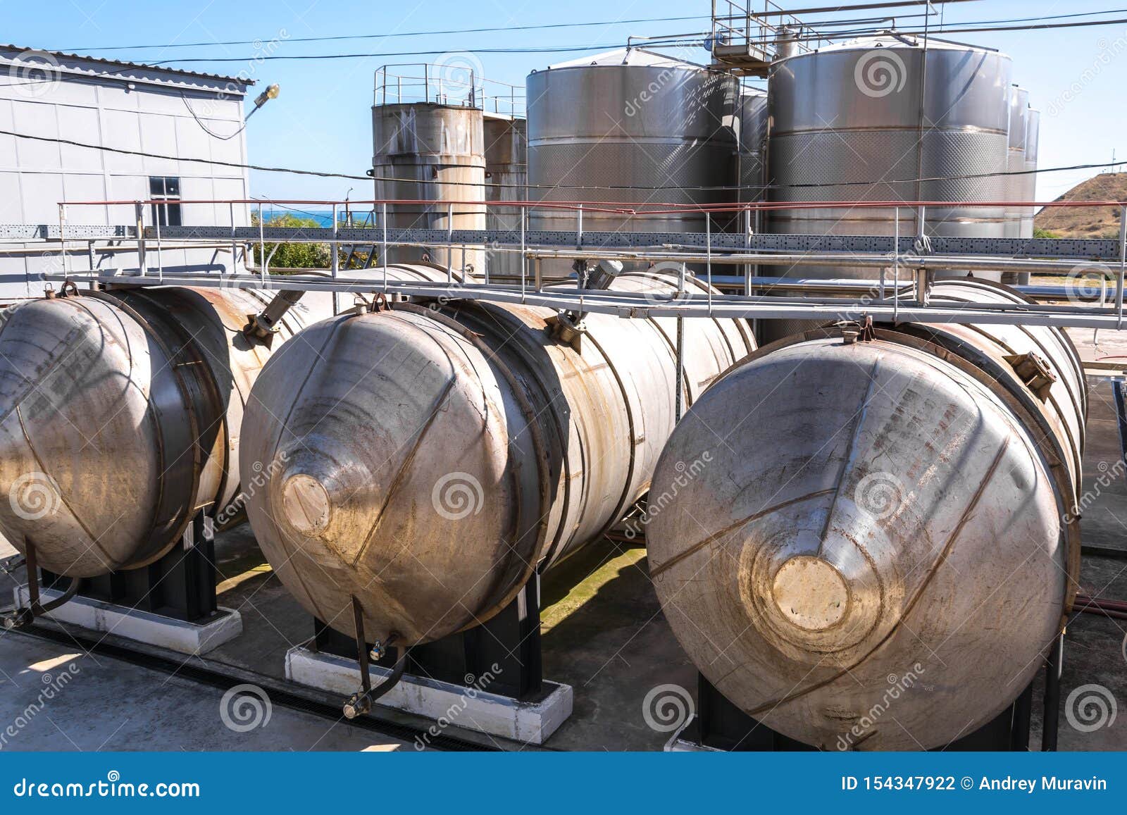 Alcohol factory stock photo. Image of storage, container - 154347922