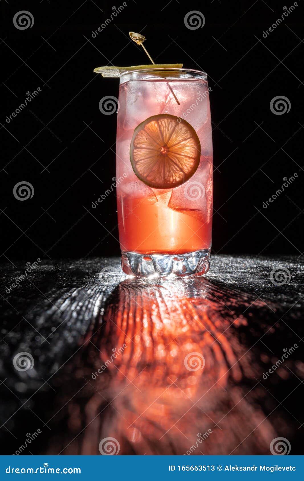 Alcoholic Cocktail with Juice Garnished with Pear. Beautiful Reflection ...