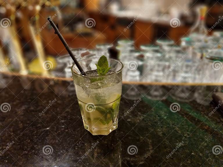 Alcoholic Drink on a Glass with Straw in the Table Stock Photo - Image ...