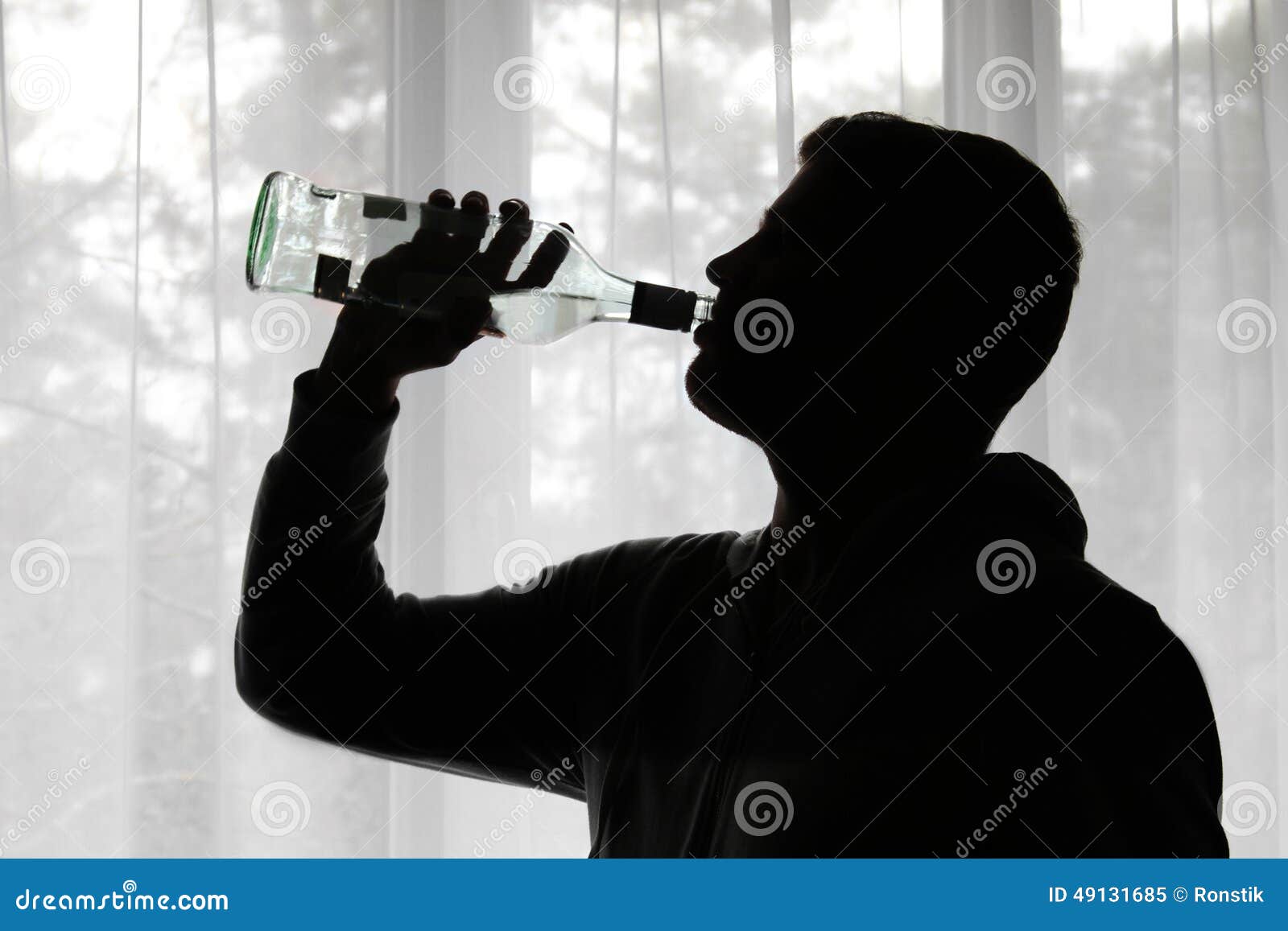 Alcoholism - Silhouette of Man Drinking Alcohol Stock Image - Image of ...