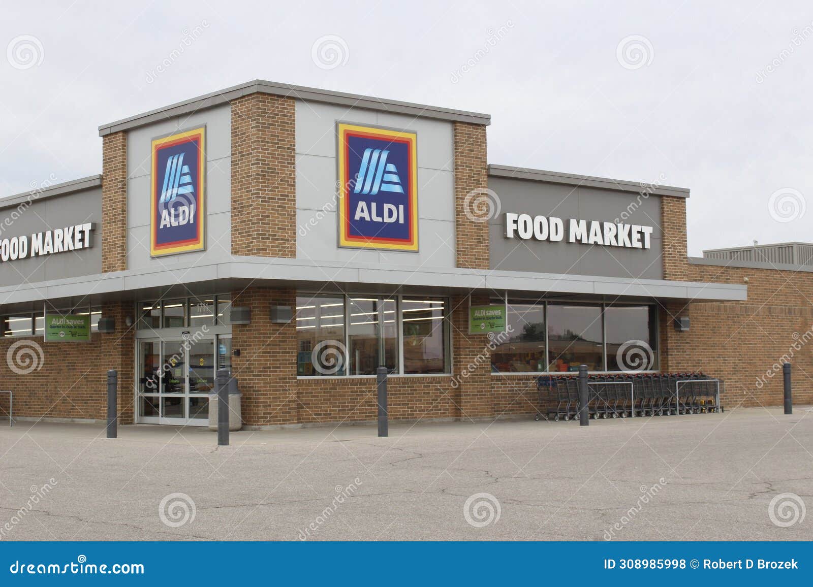 Aldi Advertisement Sign on a Building with a White Sky Outdoors ...