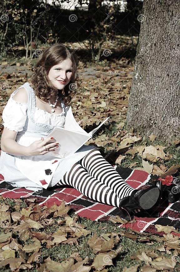 Alice reading a book stock image. Image of vintage, beautiful - 23050193
