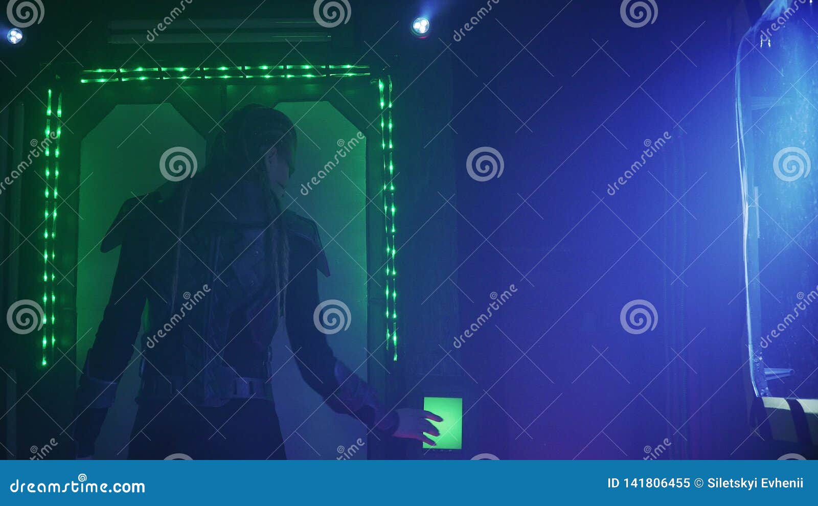 An Alien in Body Armor is Using a Control Panel on the Door in the ...