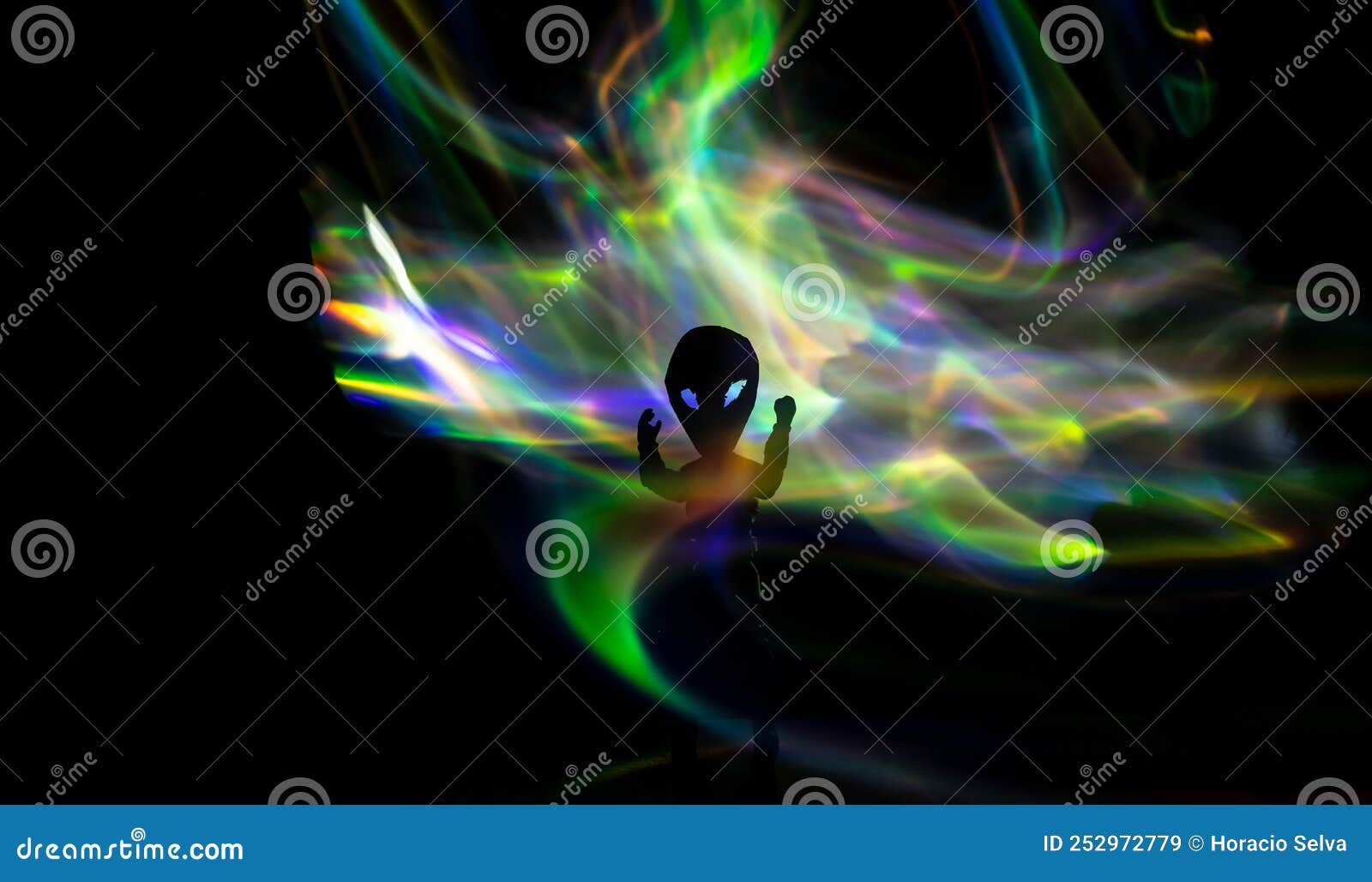 Alien-looking Humanoid Figure among Multi-colored Lights Stock ...