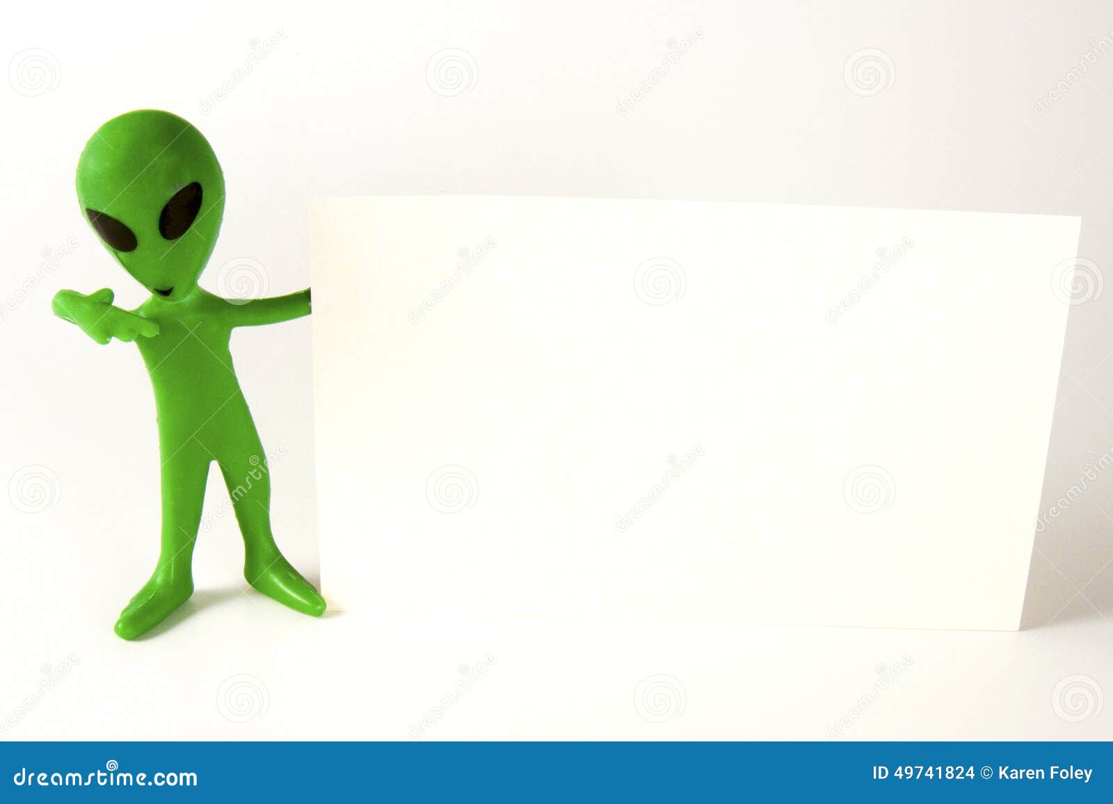 Alien Making Call Me Gesture Holding a Blank Note Stock Photo - Image ...