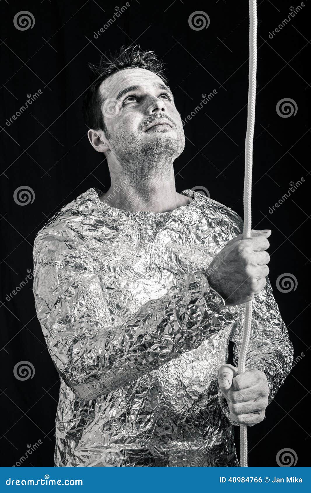 Alien Man with Rope Looking Up Stock Photo - Image of discovering ...