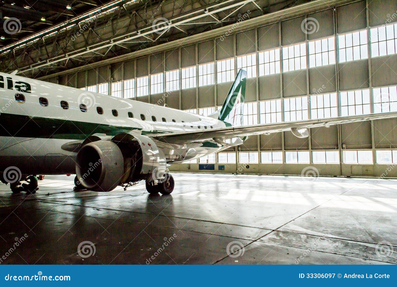 Alitalia Embraer in Hangar editorial photography. Image of private ...