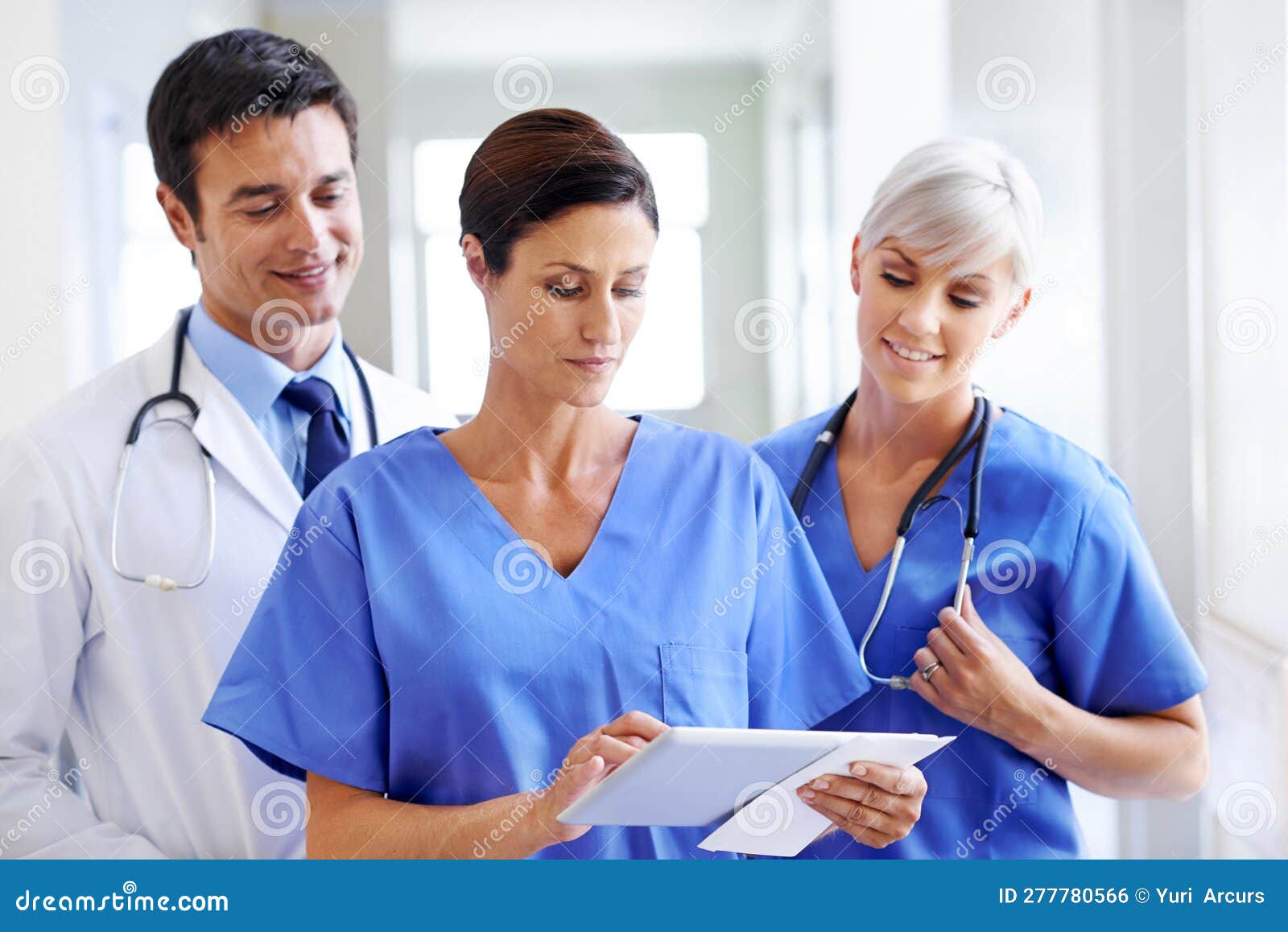 All the Patients History at Her Fingertips. Three Young Doctors Going ...