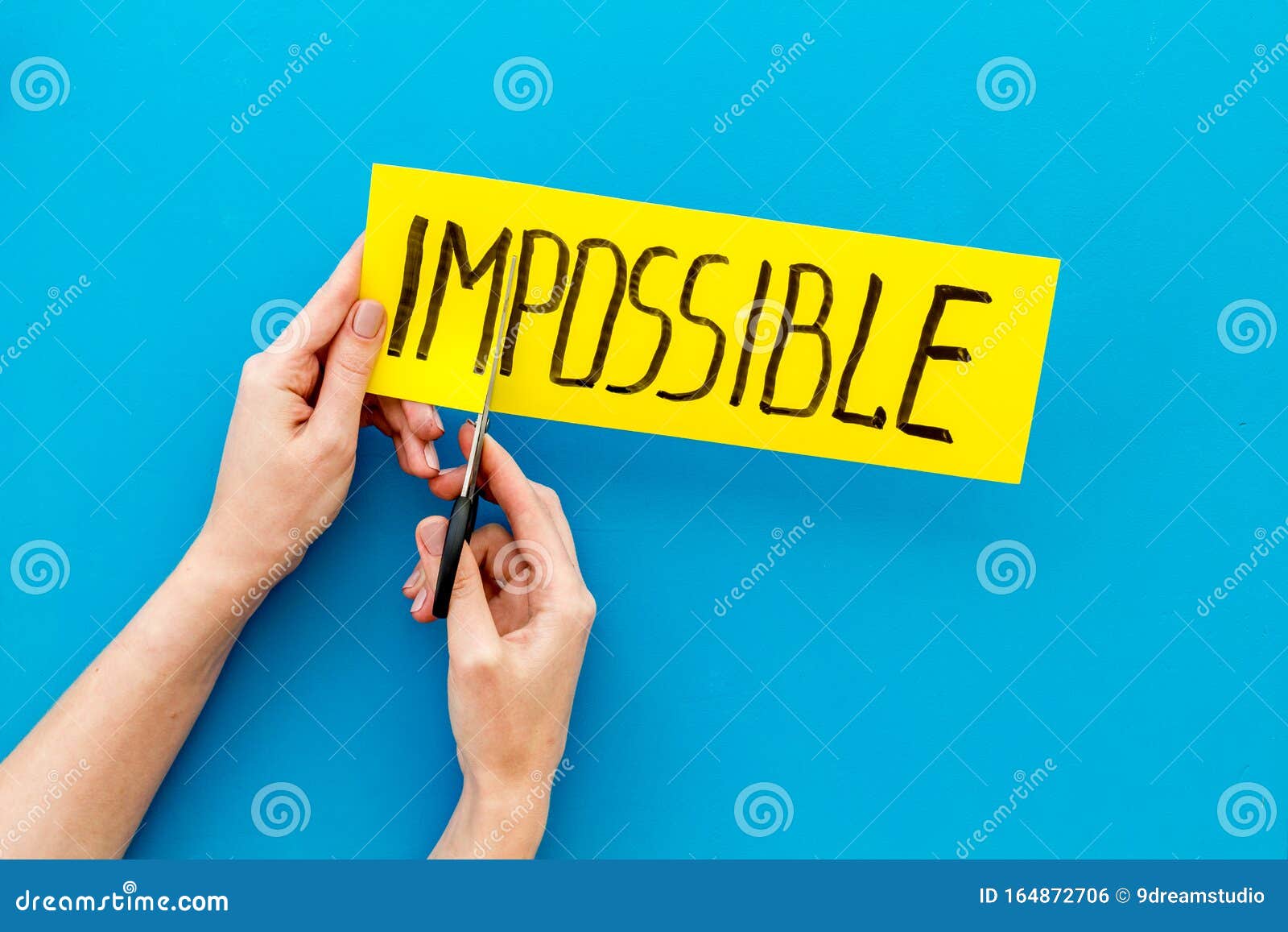 All is Possible Concept. Hands Cut Word Impossible on Blue Background ...