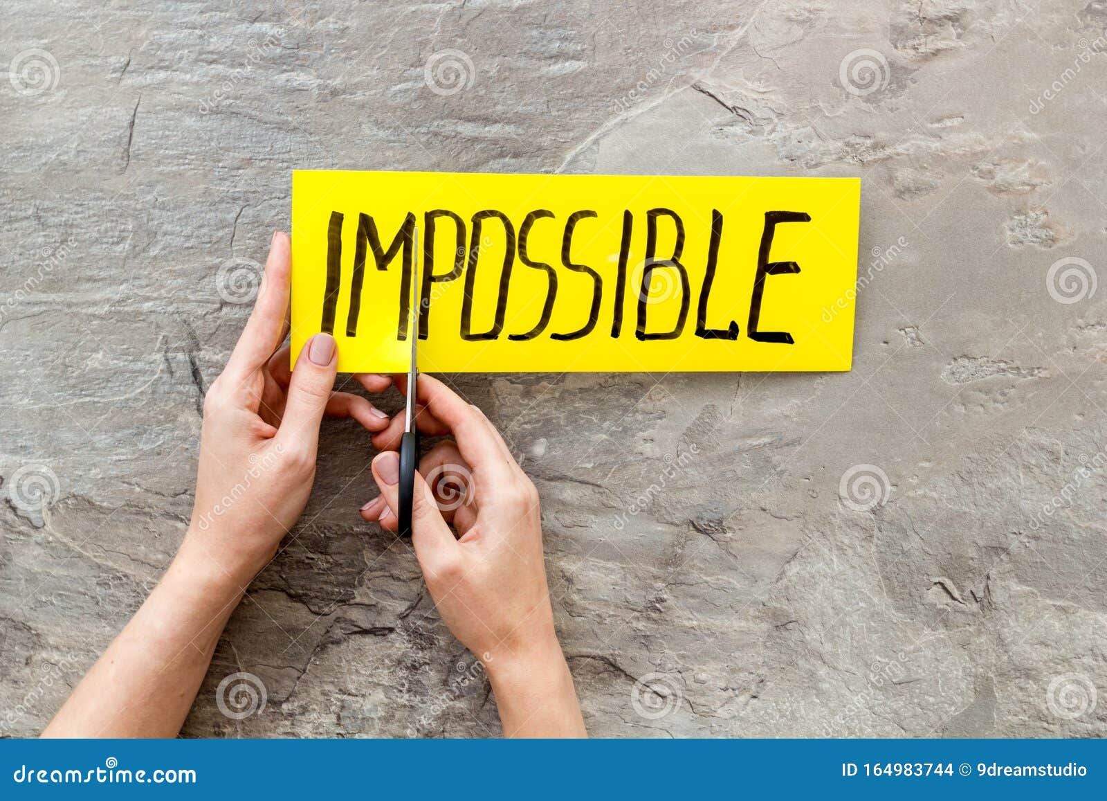 All is Possible Concept. Hands Cut Word Impossible on Grey Background ... All is Possible Concept. Hands Cut Word Impossible on Grey Background ...