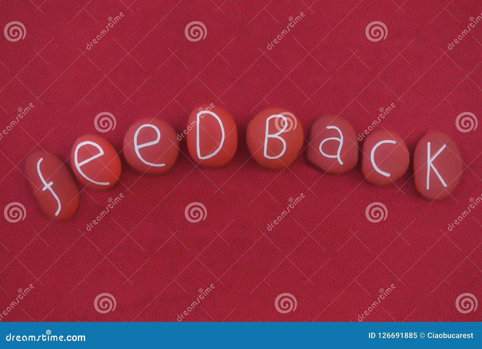 Feedback Text with Red Colored Stones Over Red Sand Stock Image - Image ...
