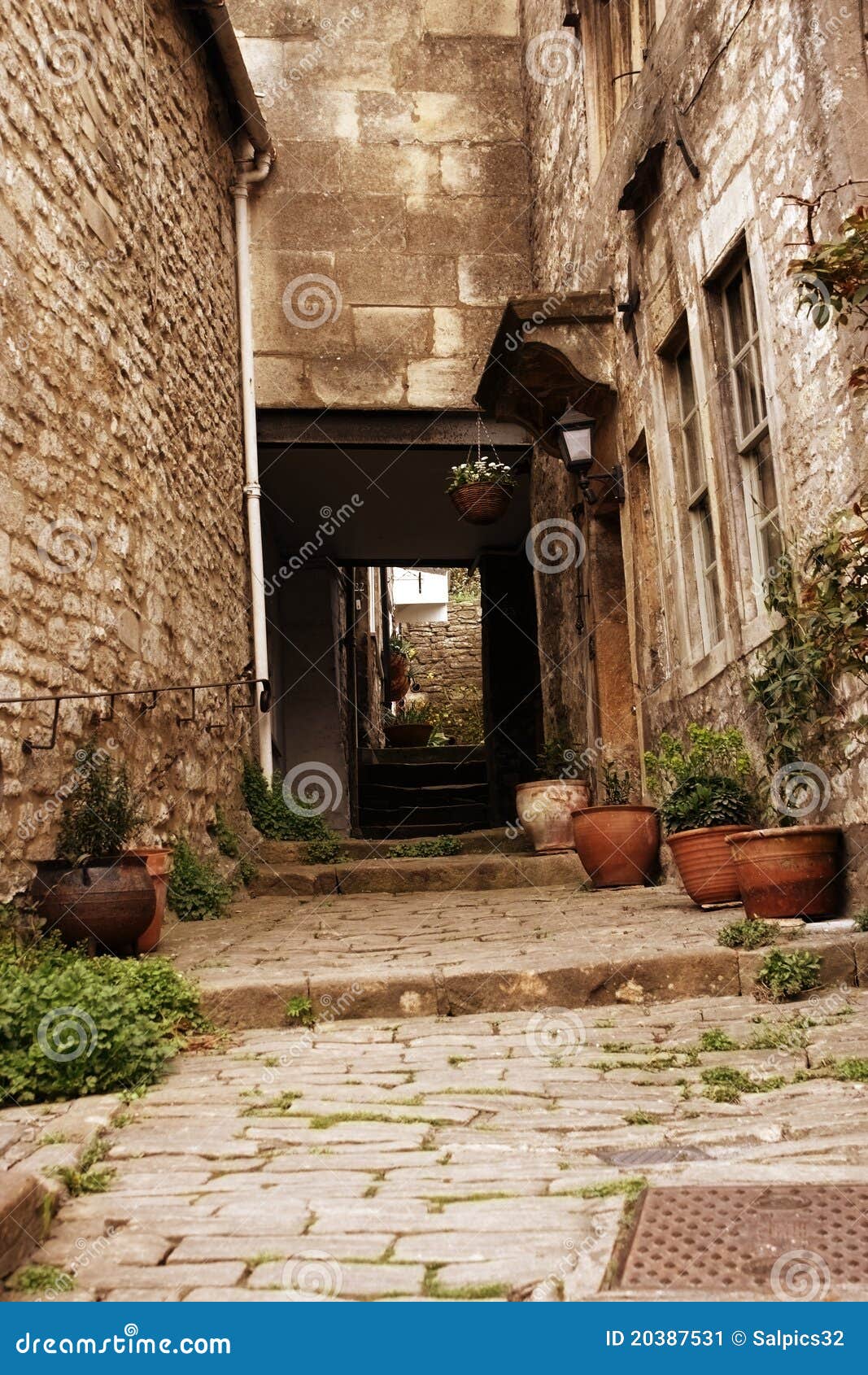 An Alley Way between the Houses Stock Image - Image of pots, rail: 20387531