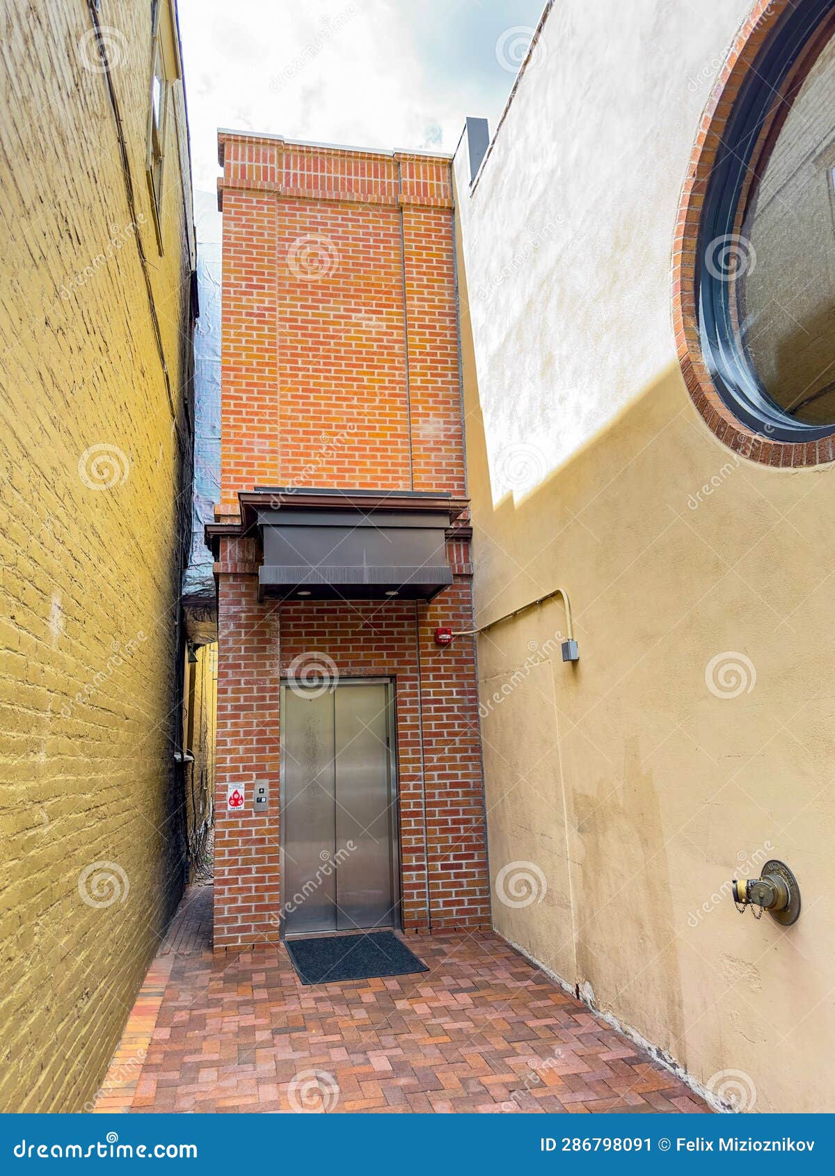 Alleyway with a Elevator between Two Buildings Stock Image - Image of ...