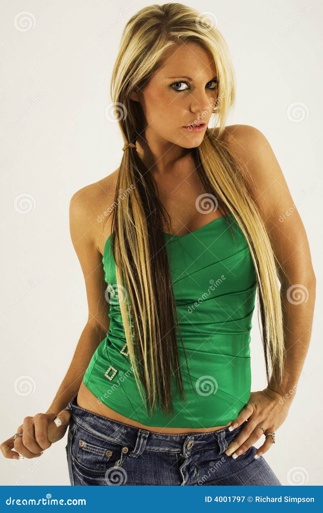 Alluring blond woman stock image. Image of jeans, pose - 4001797