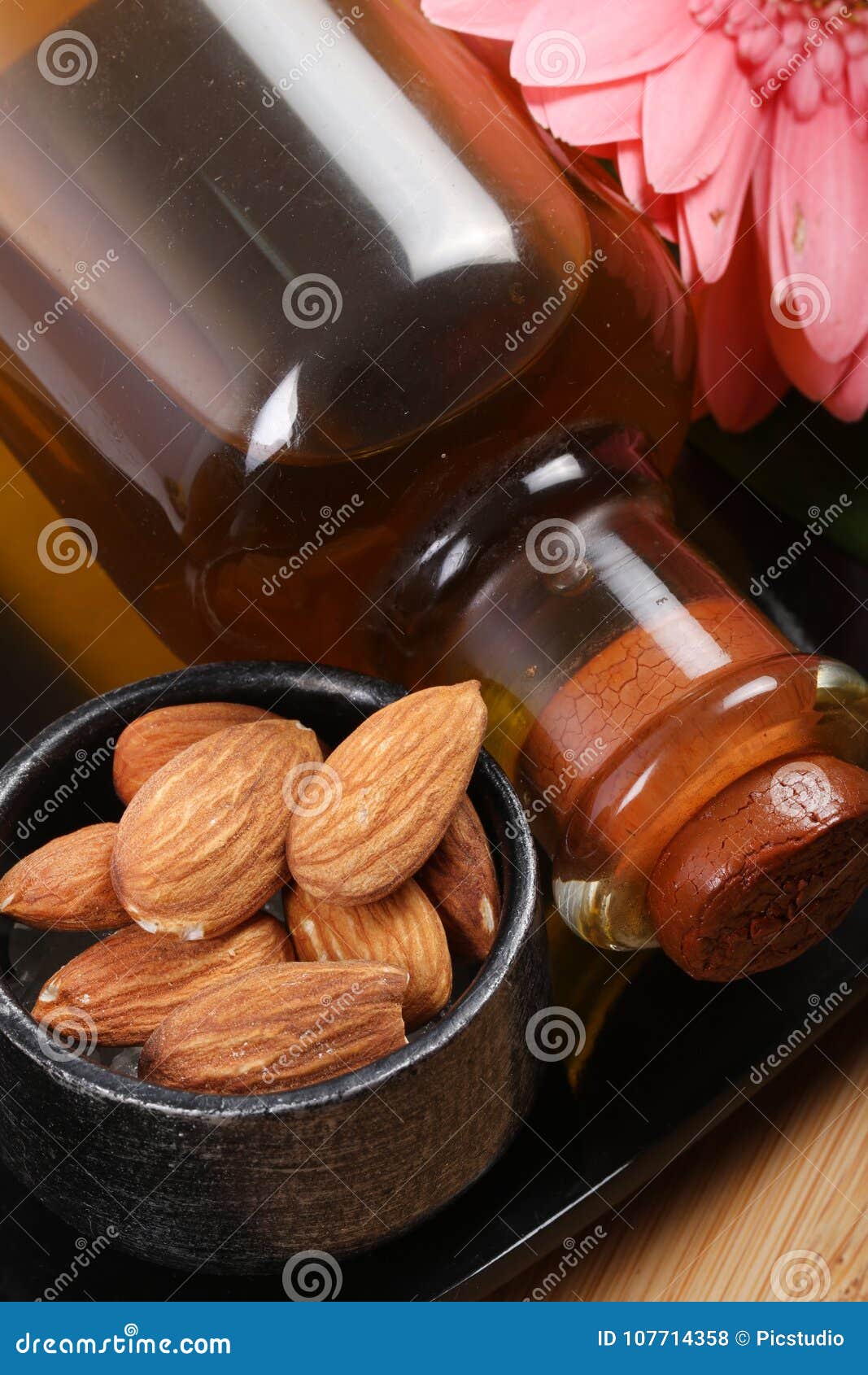 Almond nuts oil bottle stock photo. Image of crunchy - 107714358