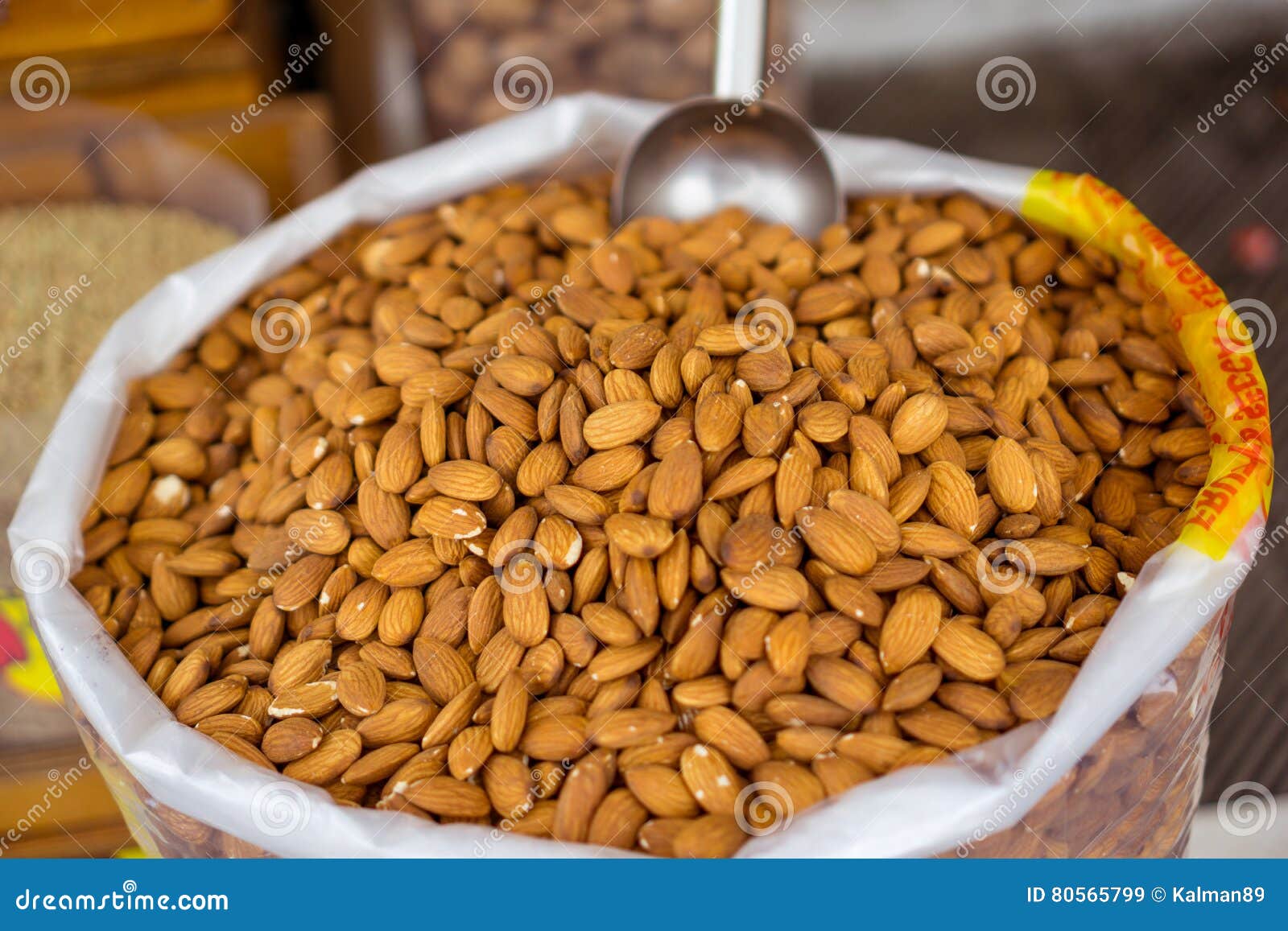 Almonds in bag stock image. Image of closeup, dipper - 80565799