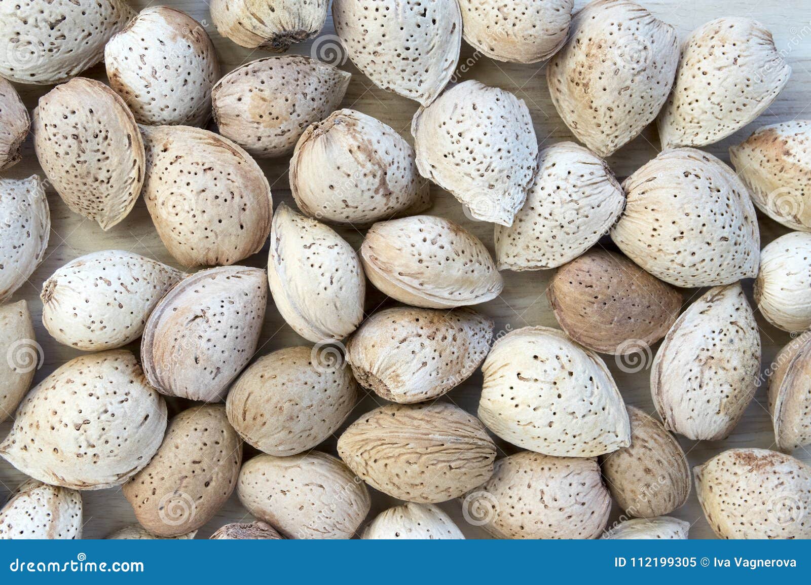 Almonds in Hard Shells, Group of Nuts on Wooden Table Stock Image ...