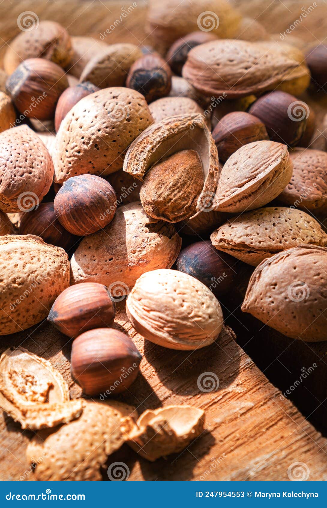 Almonds and Hazelnuts on Light Wooden Background. Varieties of Nuts ...