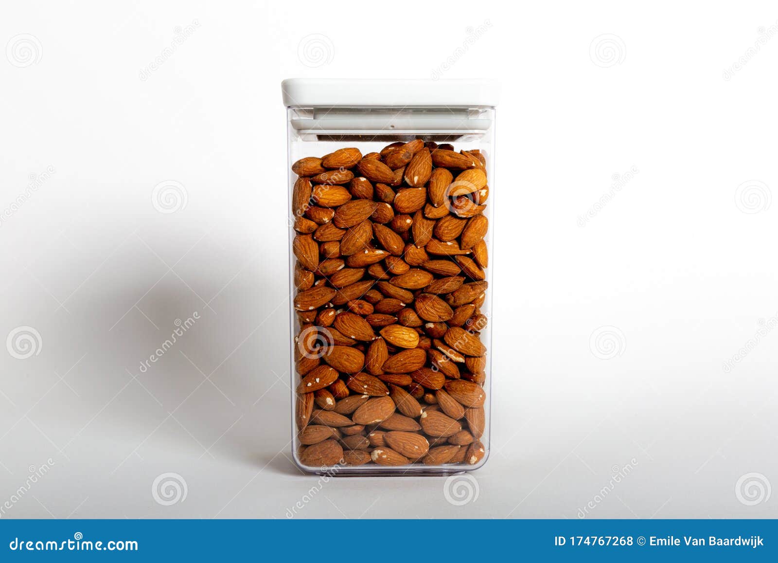 Almonds Inside a Transparent Plastic Container with a White Background ...