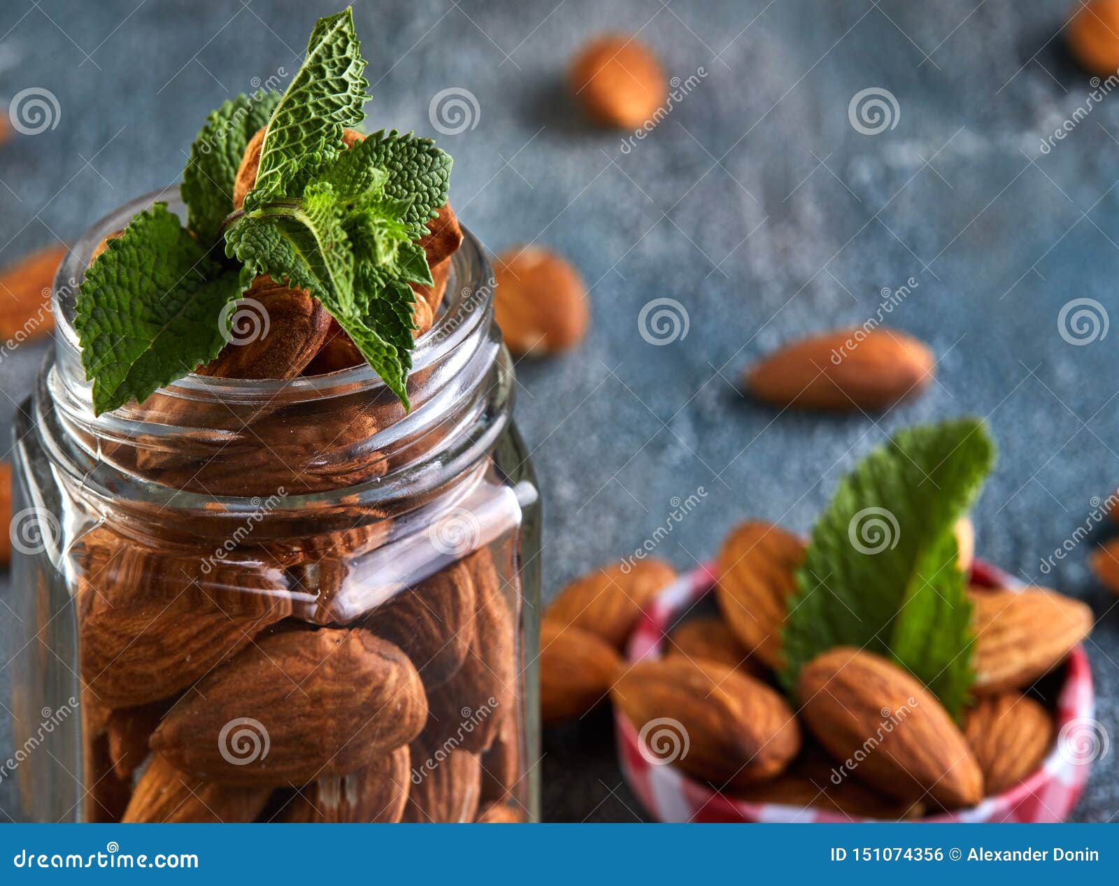 Almonds in a Transparent Jar with Sheets of Mint on the Top Stock Photo ...